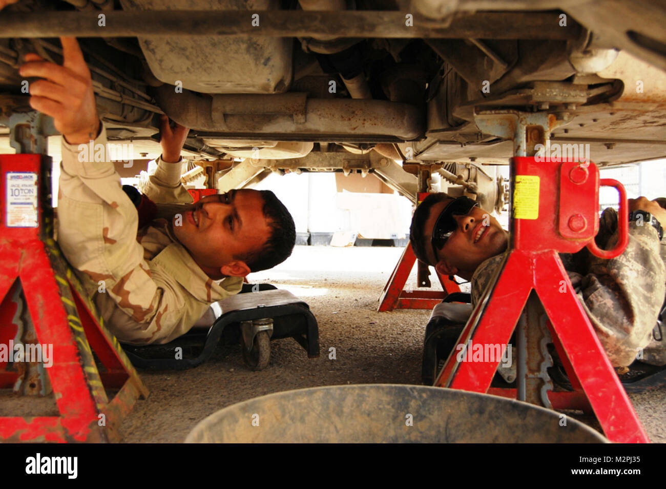 Spc. Anthony Wong, right, a mechanic with B Company, 1st Battalion ...