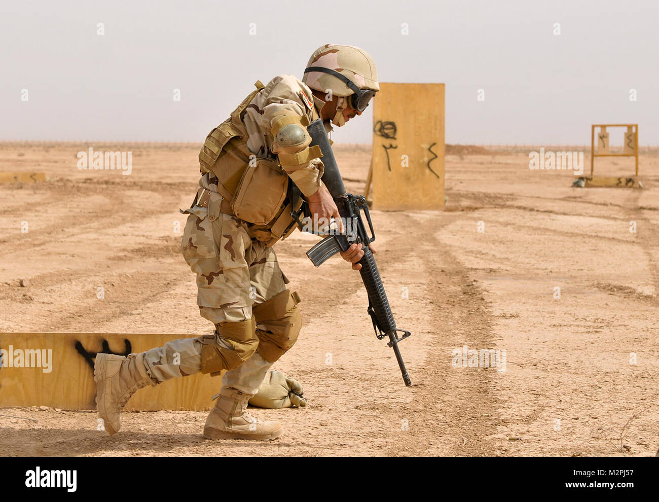 Iraqi jundi sprints to cover KIRKUSH MILITARY TRAINING BASE, Iraq – A ...