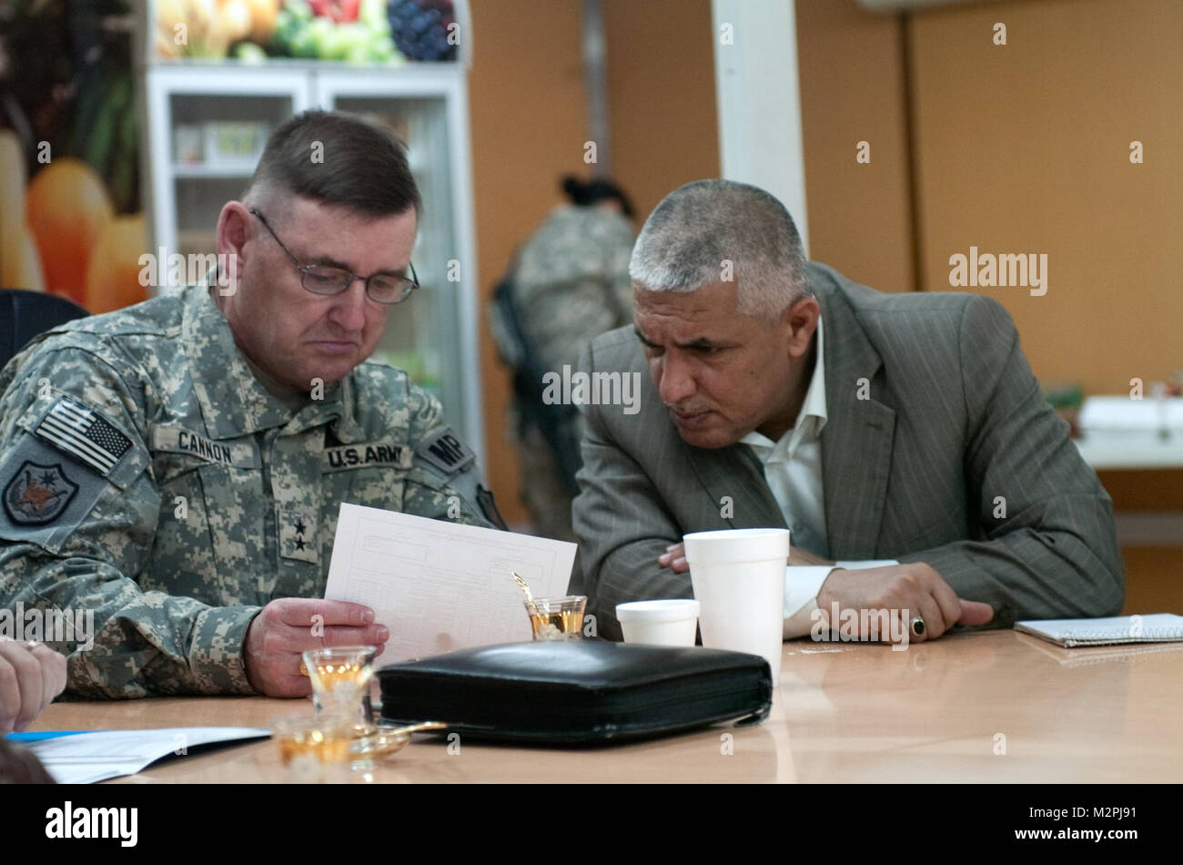 Maj. Gen. Jerry Cannon signs paperwork to turnover 100 vehicles to the ...
