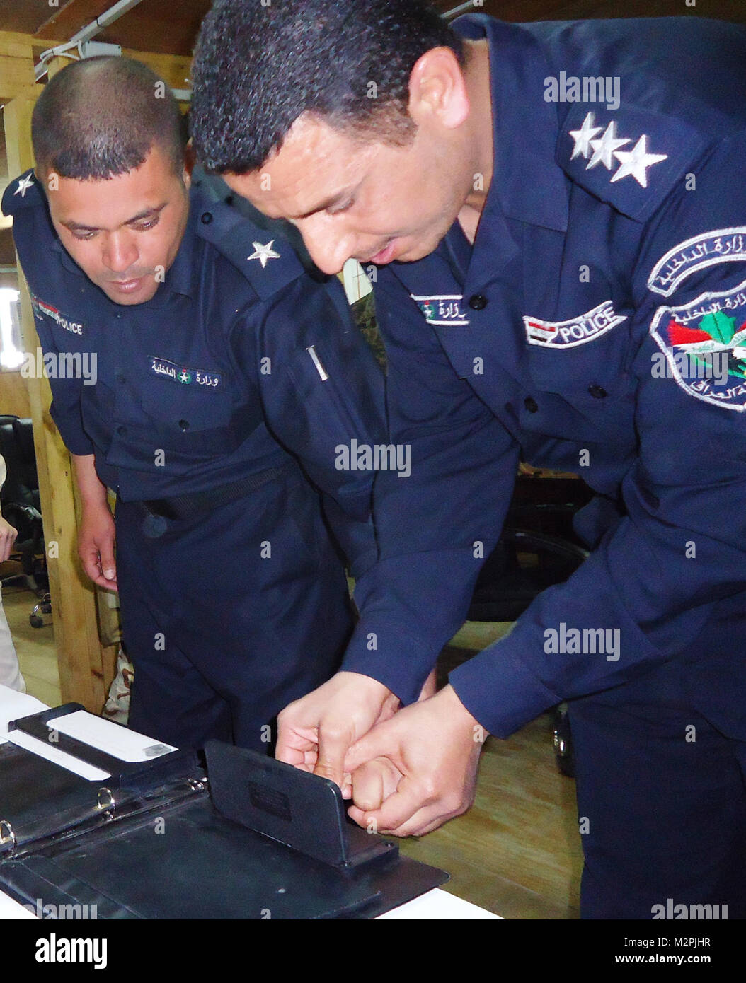 Iraqi Police officers 2nd Lt. Salam, left, and Capt. Salam, practice ...