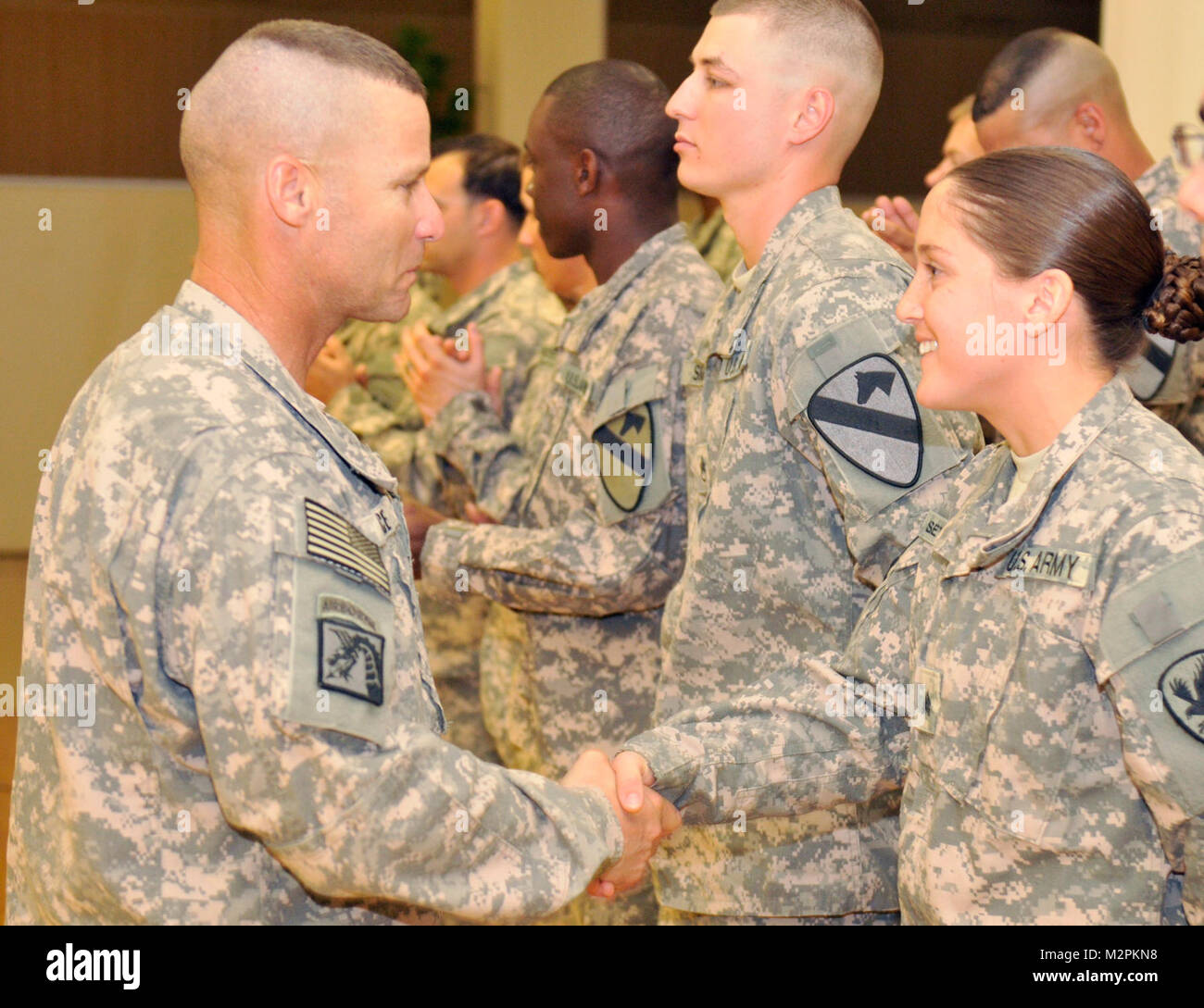 Command Sgt. Maj. Rice congratulates Sgt. Setterington. CONTINGENCY ...