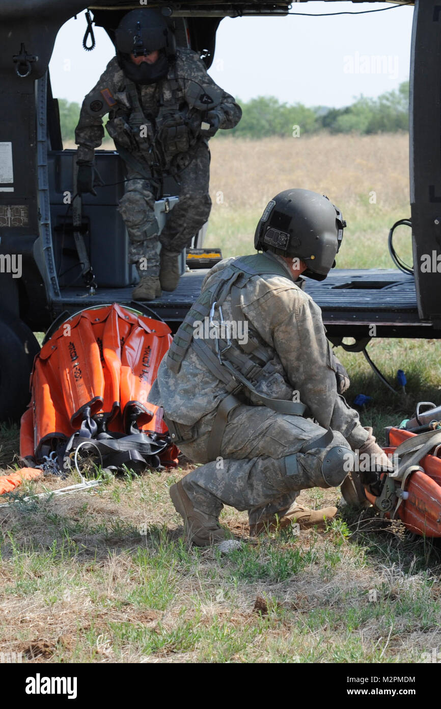Texas National Guard UH-60 Blackhawk crew members, SSG Brant Spinn and ...