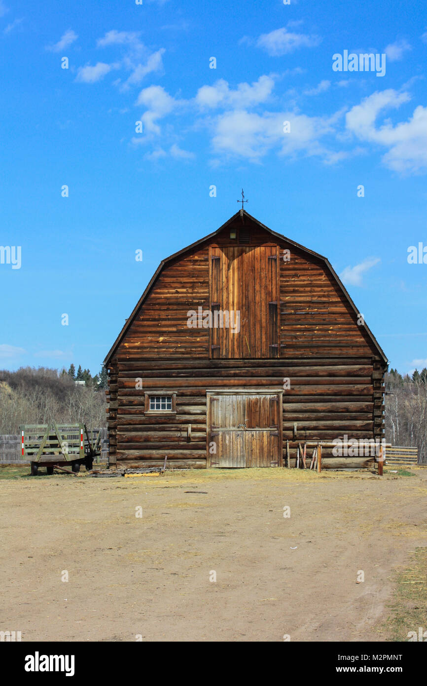 Vertically shot vintage log barn during springtime Stock Photo - Alamy