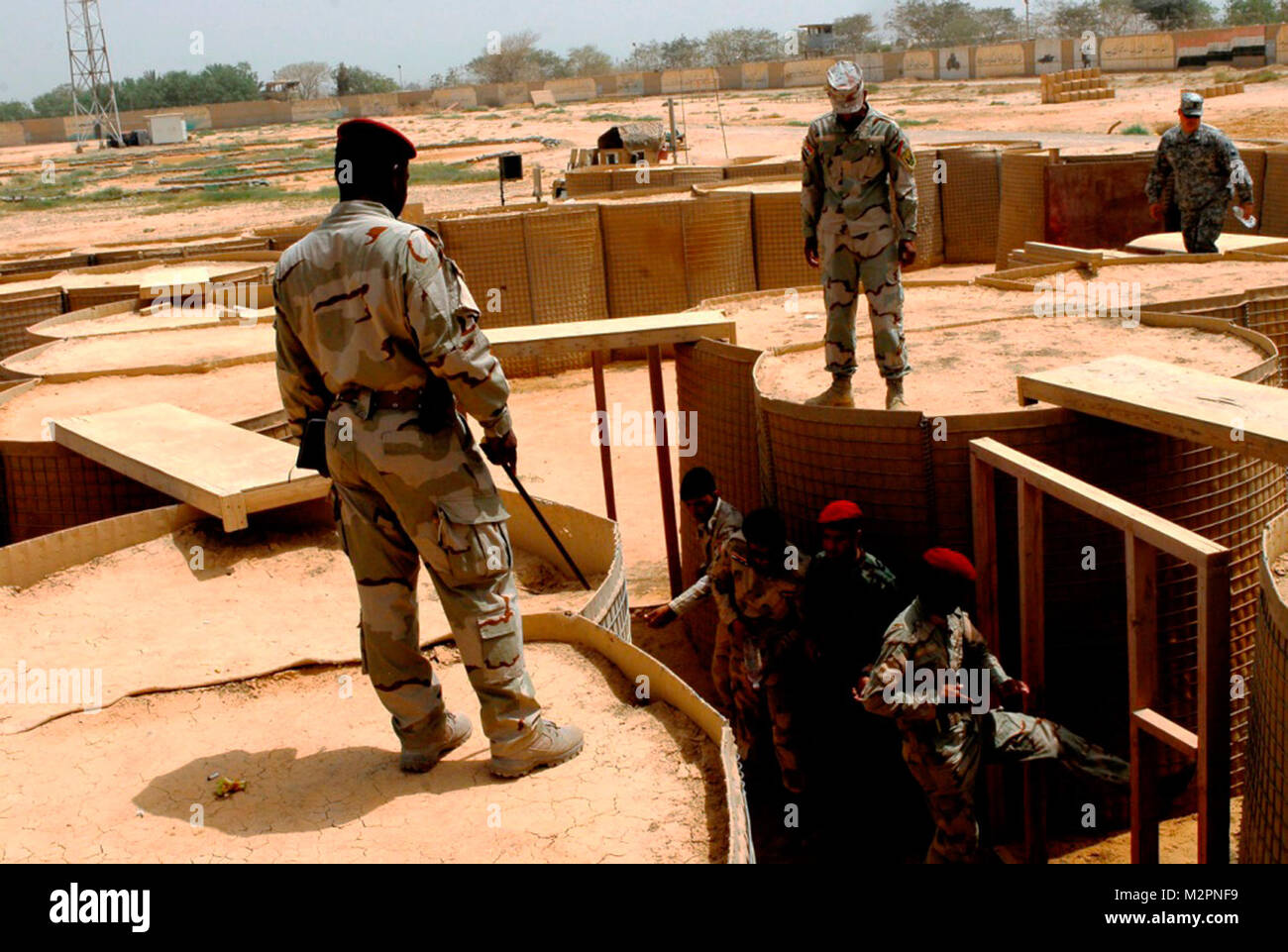 Command Sgt. Maj. Mohammed Sharhan, left, command sergeant major of the ...