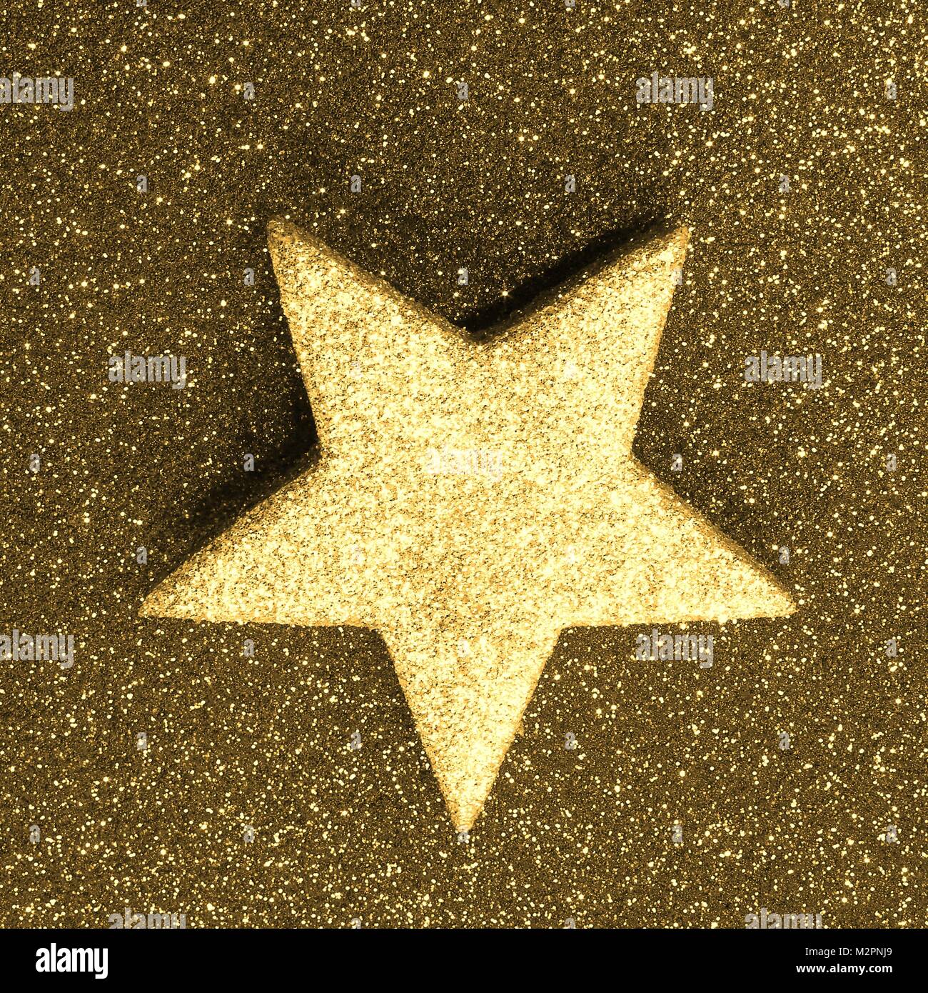 lone great golden star on golden background Stock Photo - Alamy