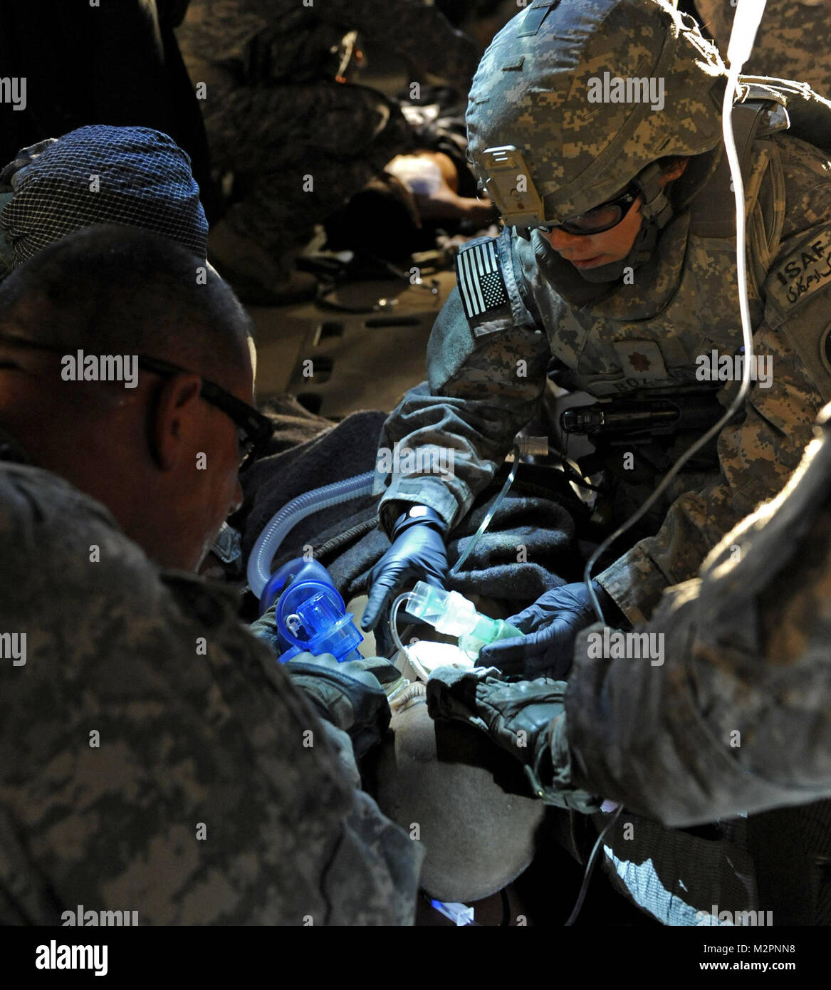 Maj. (Dr.) Tracy Bozung, Provincial Reconstruction Team Zabul, treats a ...