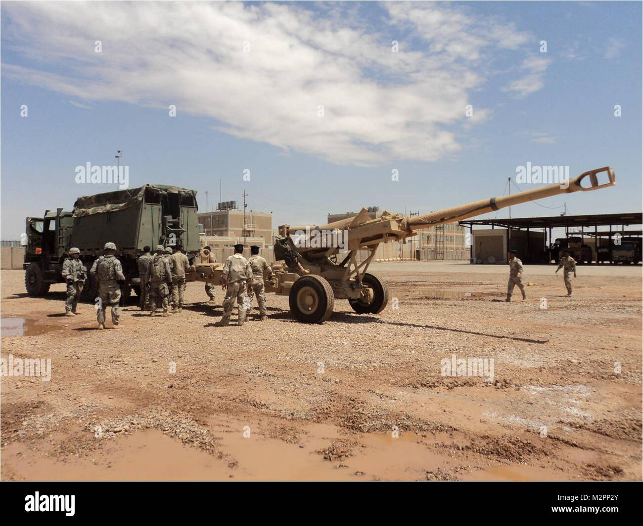 Emplacing the howitzer. KIRKUSH MILITARY TRAINING BASE, Iraq – Iraqi ...