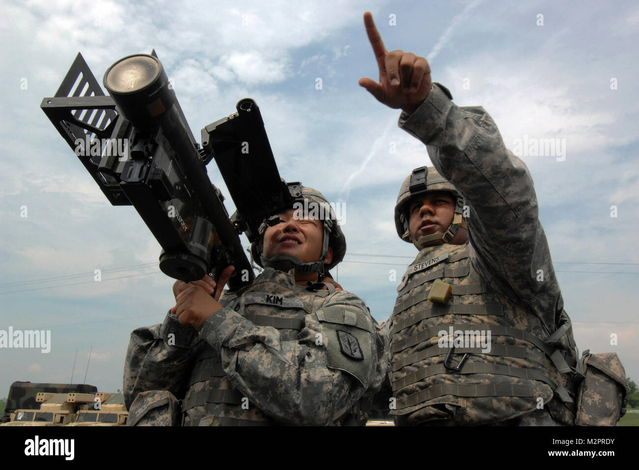Pfc. Andrew Kim, a gunner, and Spc. David Stevens, a team leader with ...