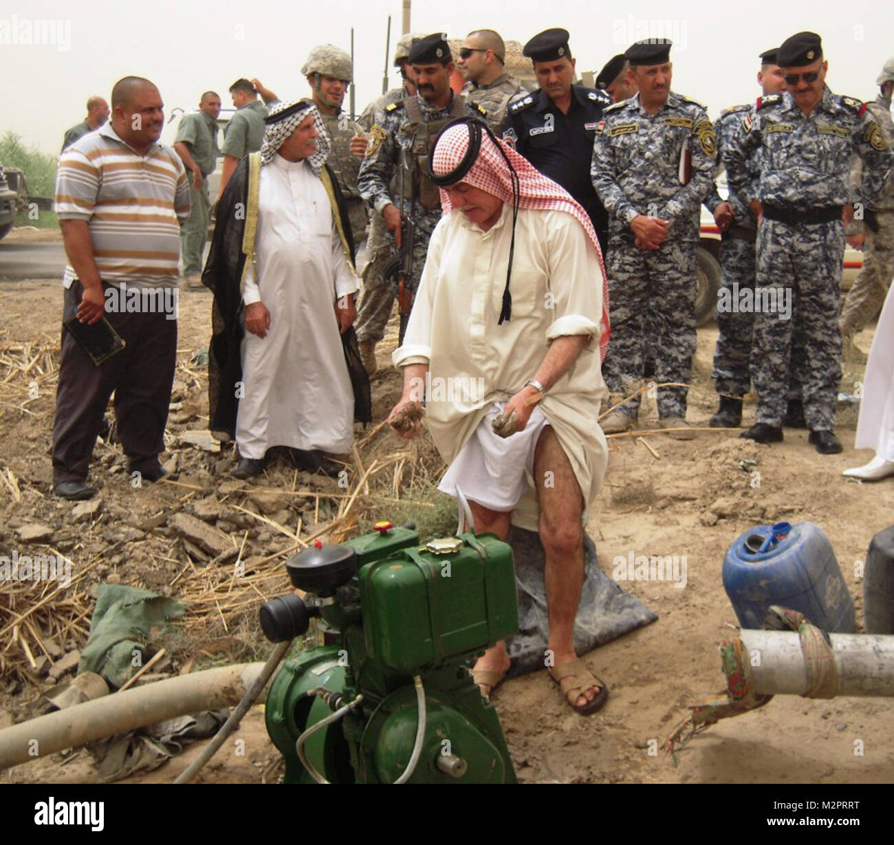 Officers with the 4th Iraqi Federal Police Division and local elders ...