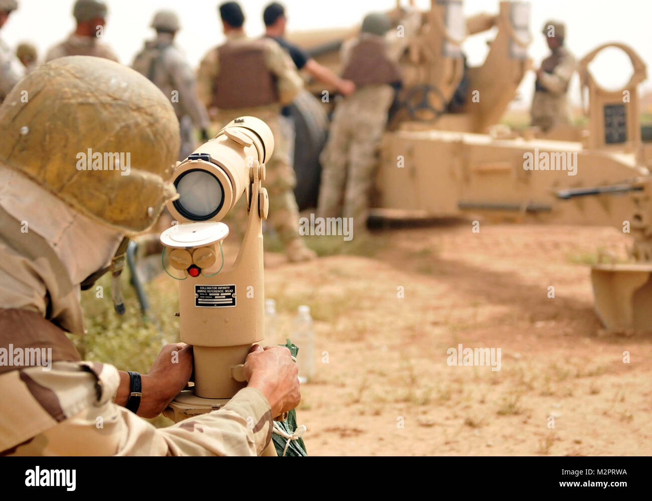Sighting the howitzer. KIRKUSH MILITARY TRAINING BASE, Iraq – An Iraqi ...