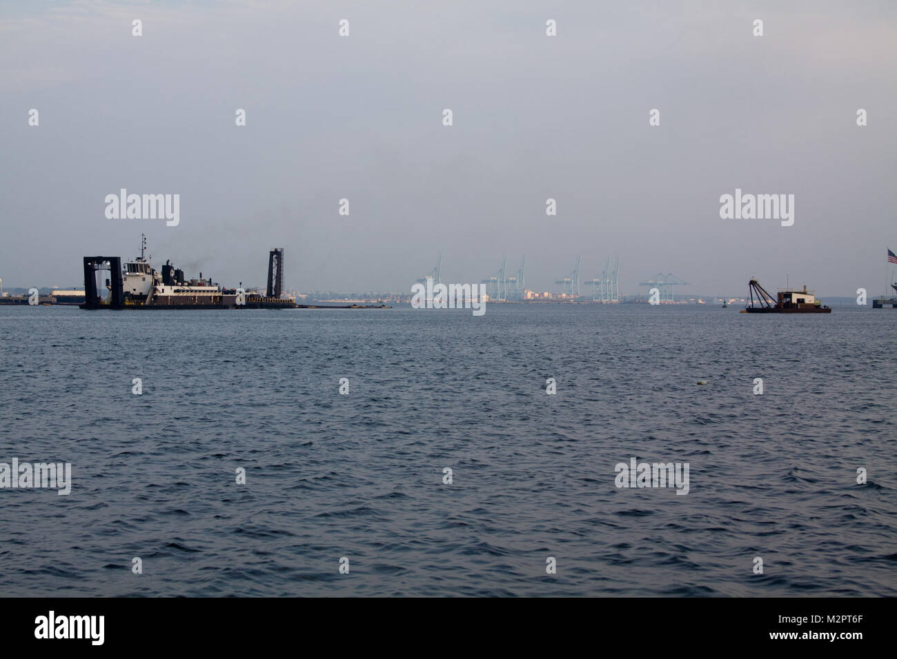 The Norfolk Dredging Company’s hydraulic dredge CHARLESTON works to ...