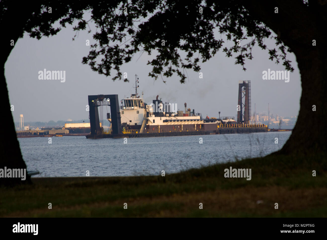The Norfolk Dredging Company’s hydraulic dredge CHARLESTON works to ...