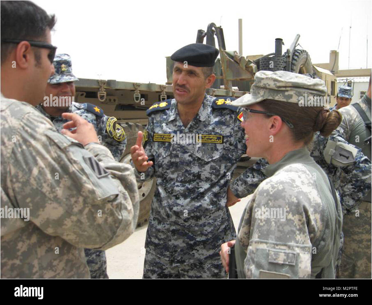 Iraqi Federal Police Col. Kareem, center, commander of Sustainment ...