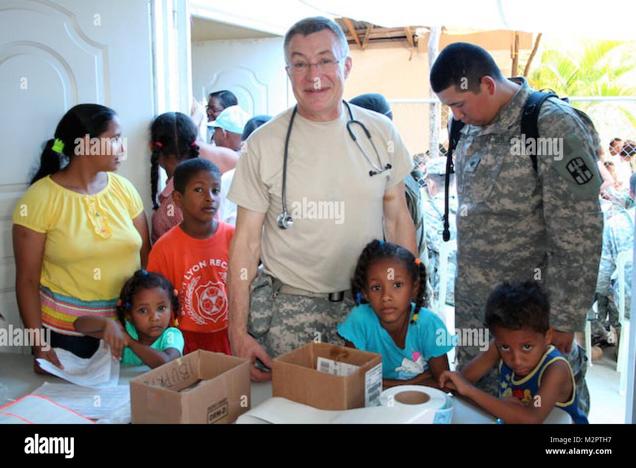 Lt. Col. Hunter Hammill poses for a picture with a Dominican family ...