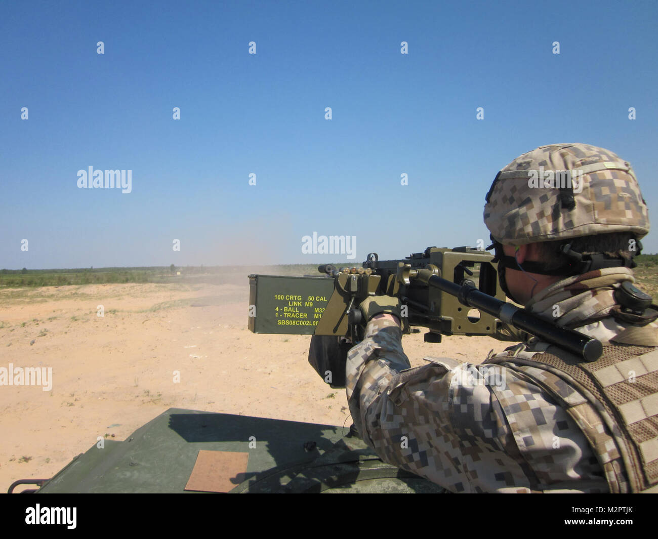 Latvian practices with a .50 machince gun during Operation Summer ...