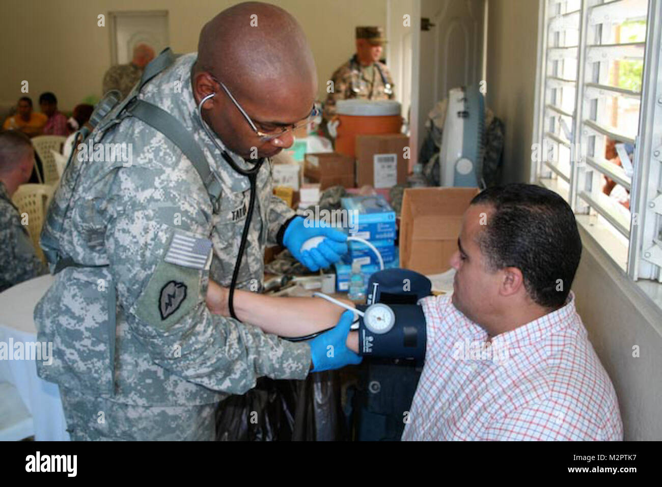 Capt. Gary Tatum, 228th Combat Support Hospital, San Antonio, checks ...
