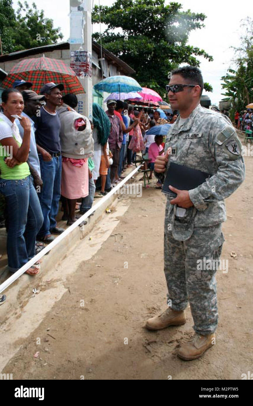A Civil Affairs Officer fluent in Spanish, provides information to ...