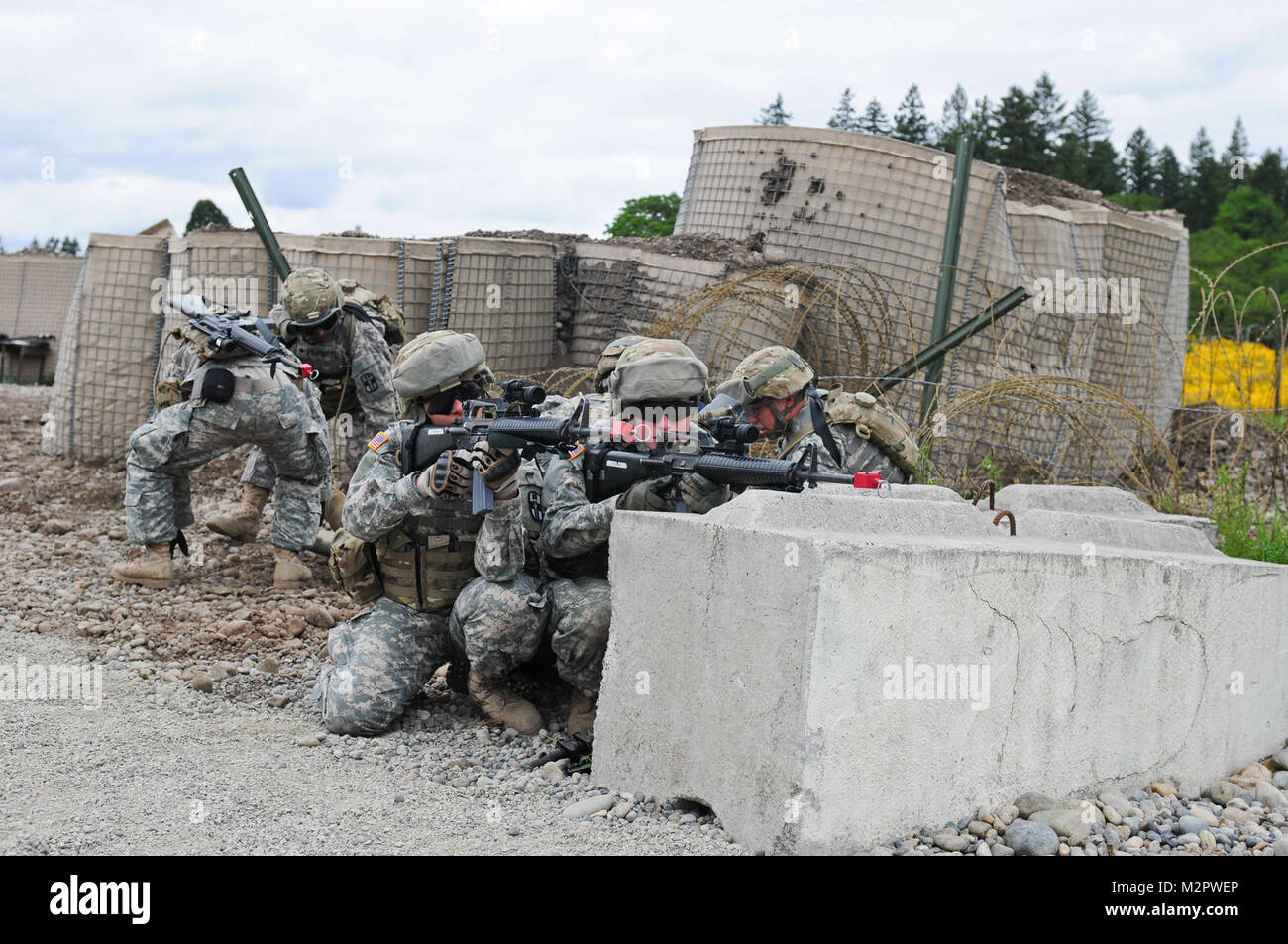 Soldiers of the 113th Combat Stress Control Detachment defend the entry ...