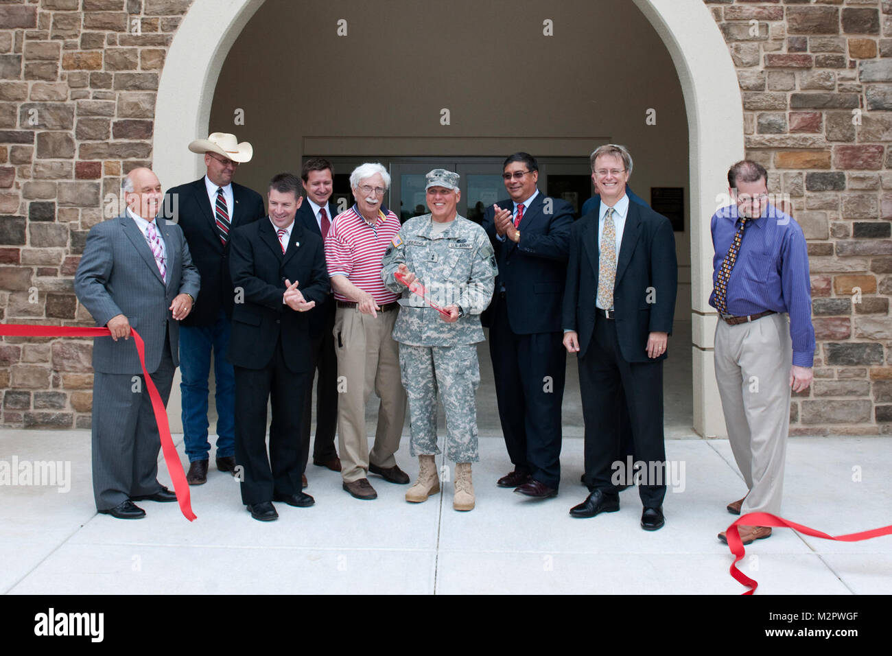 Maj. Gen. Myles Deering (center), adjutant general for Oklahoma, cuts ...