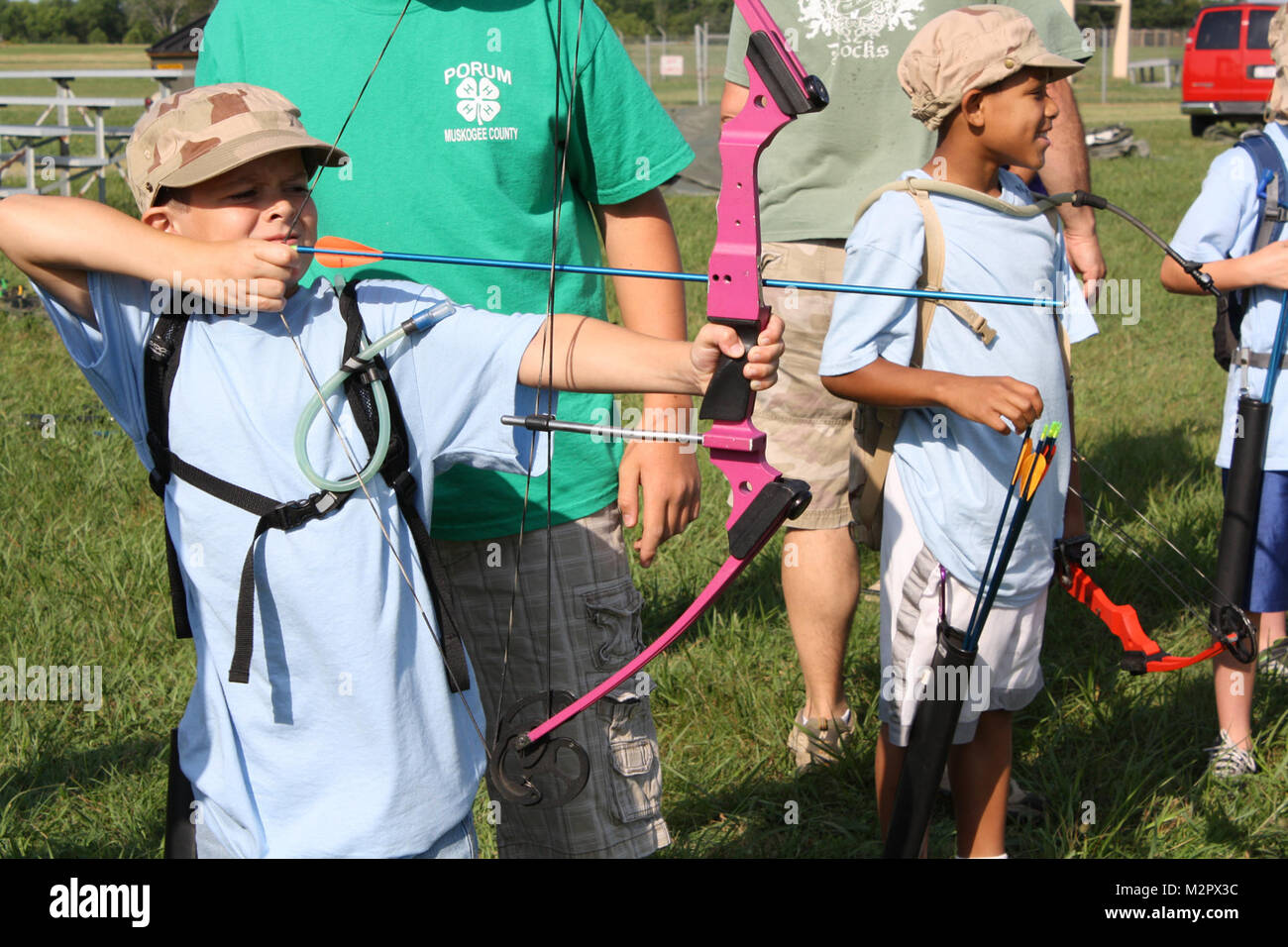 Campers at the Oklahoma National Guard Kids Kamp 2011 take aim during ...