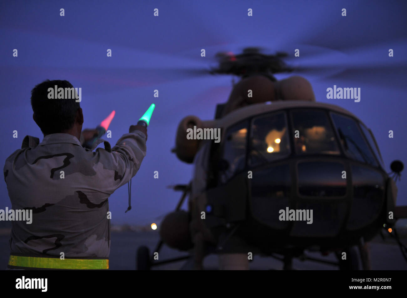 An Iraqi Army Aviation Command, Squadron 15 ground crew member performs ...