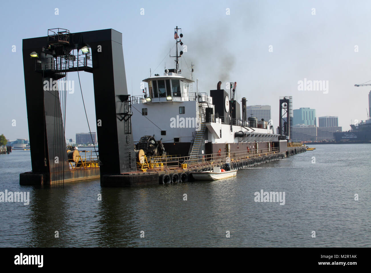 The Norfolk Dredging Company’s hydraulic dredge CHARLESTON works to ...