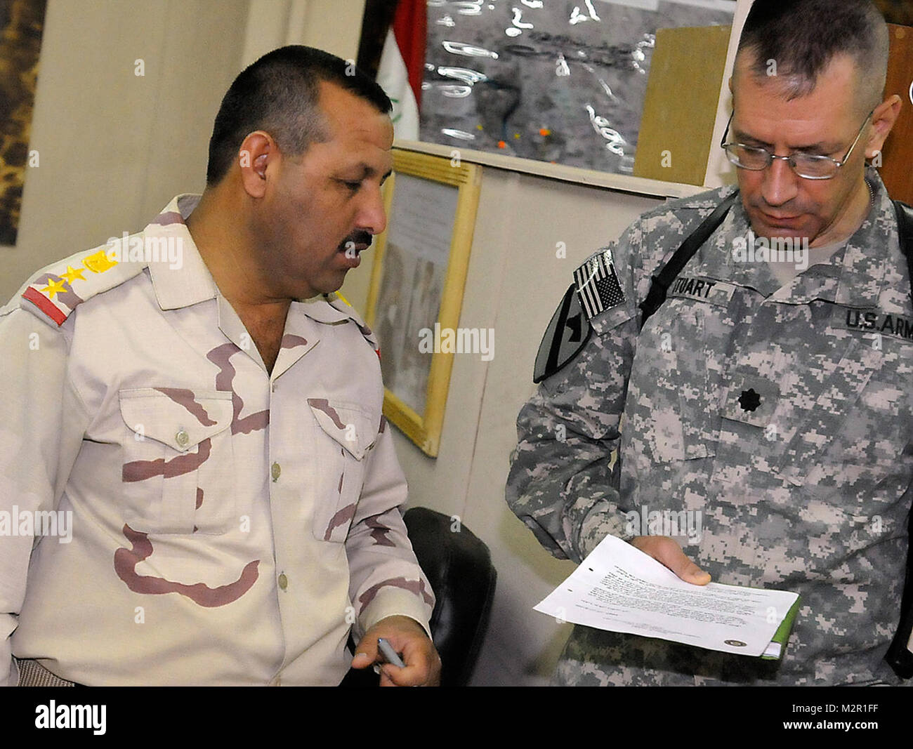 Discussing the paperwork. CONTINGENCY OPERATING SITE MAREZ, Iraq ...
