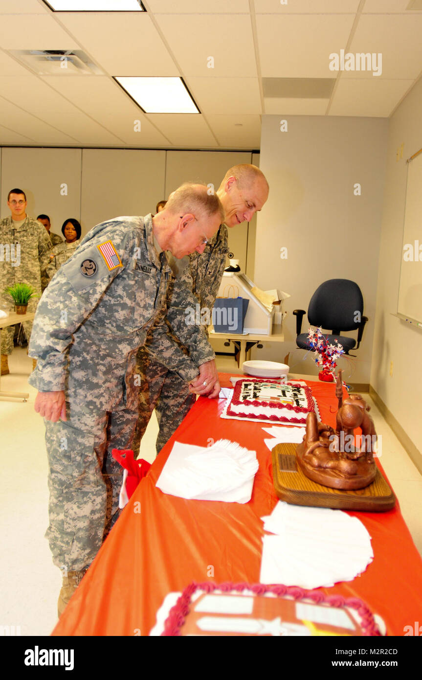 Brig. Gen. John Donnelly III and Col. James Mason cut a cake in honor ...