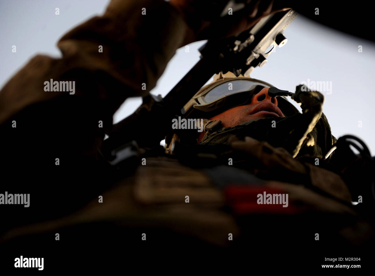 U.S. Army Spc. Mark Santos, rifleman, secures his sector of fire in a ...