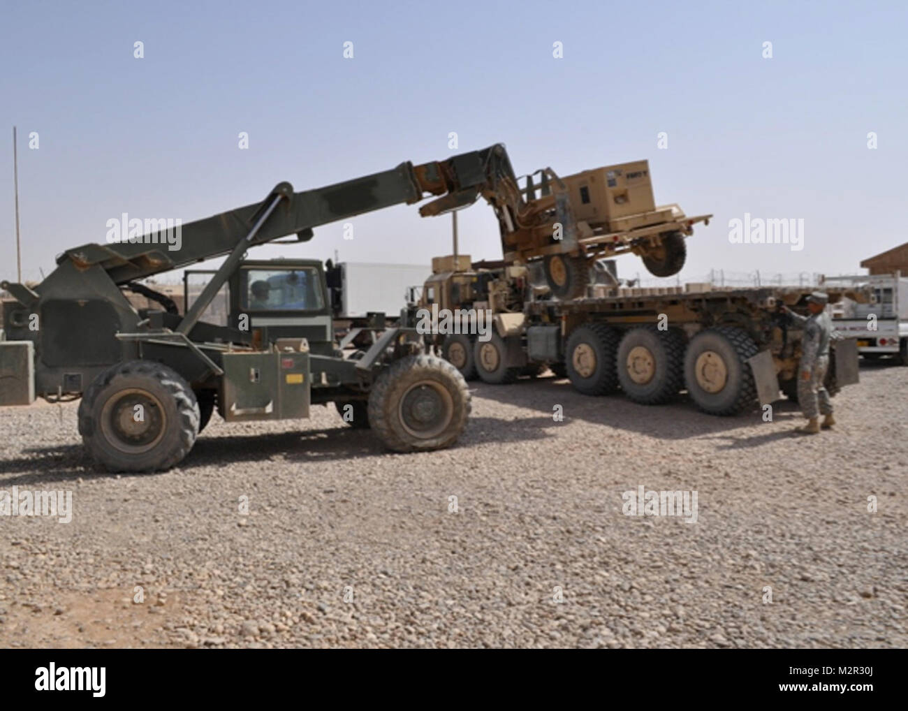 Soldiers load equipment. KIRKUSH MILITARY TRAINING BASE, Iraq ...