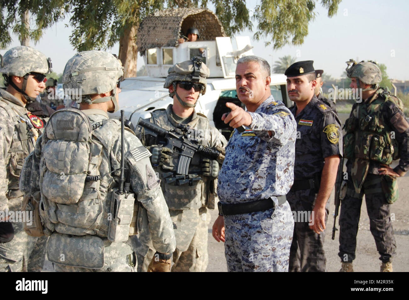 First Lt. Kevin McGrew, third from left, a platoon leader with Company ...