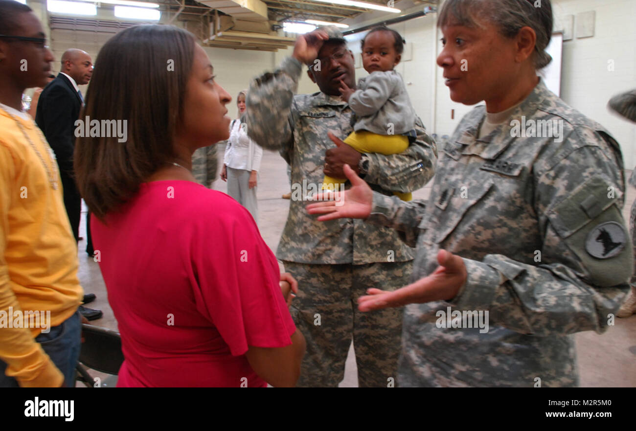Lt. Col. David Fleming III and family, with State Command Sgt. Maj. by ...