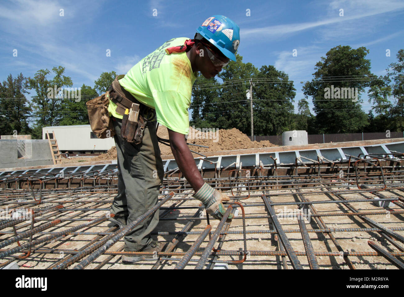 Rickee Davenport with Magic Steel puts rebar in place at the Langley ...