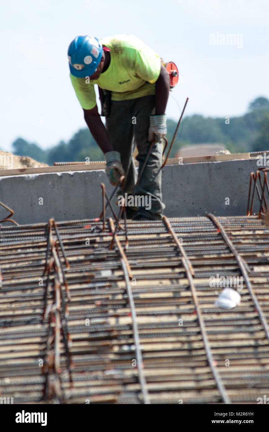 Rickee Davenport with Magic Steel puts rebar in place at the Langley ...