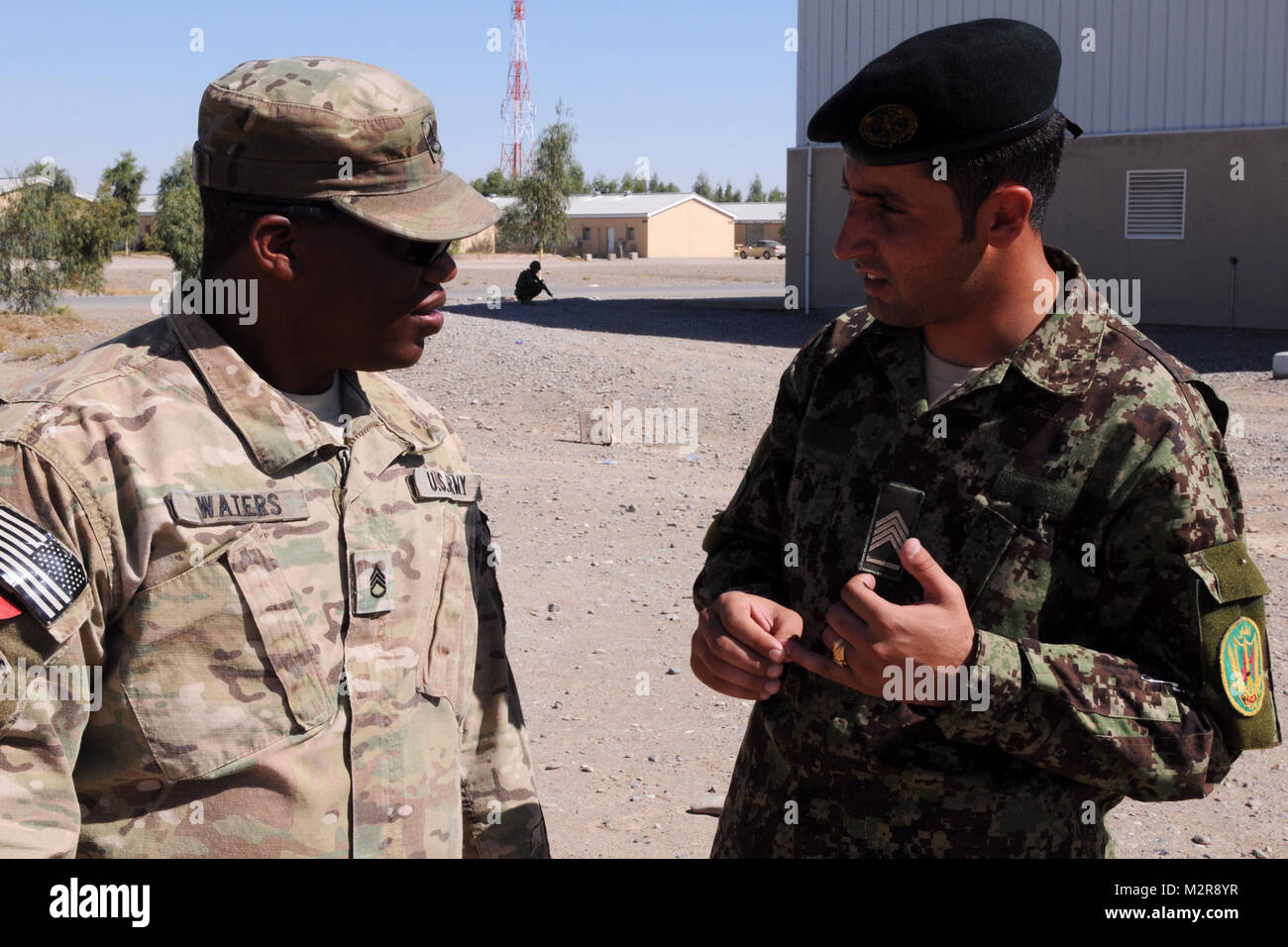 Staff Sgt. Spencer Waters talks training tactics with First Sgt. Roman ...