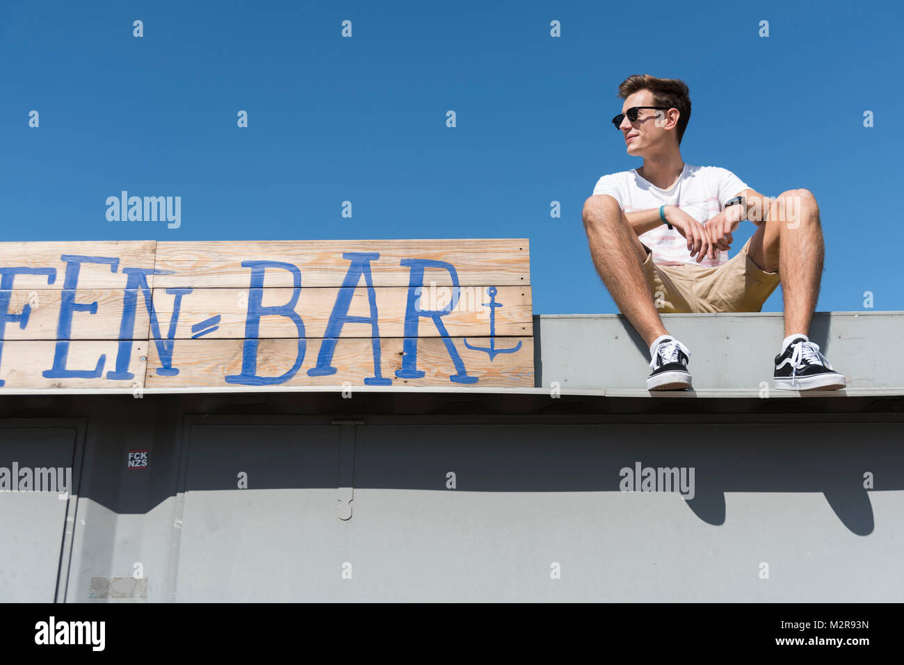 Man on roof hi-res stock photography and images - Alamy