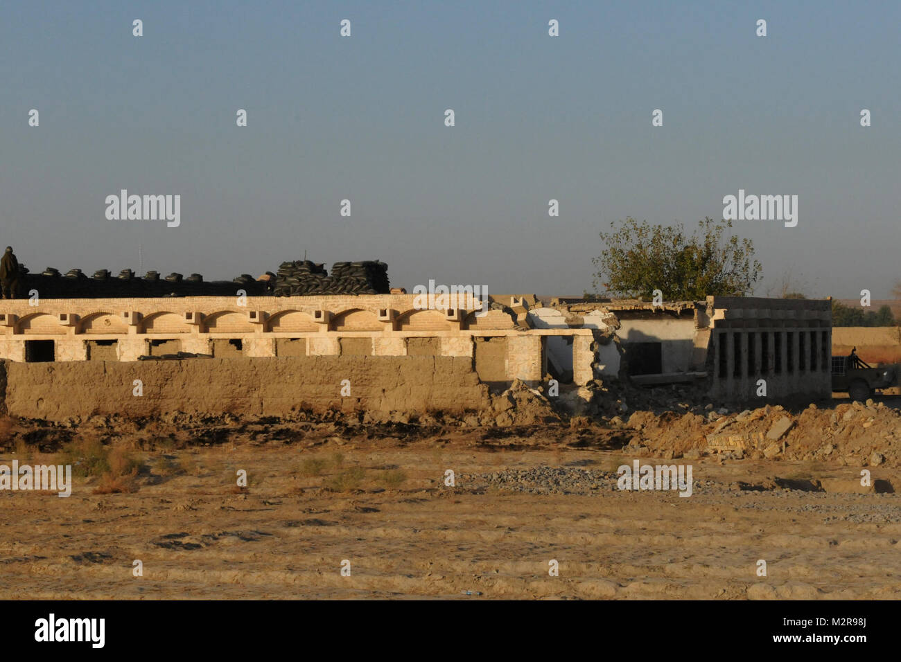 A compound isnDo'ab, used as a checkpoint in the village, shows the ...
