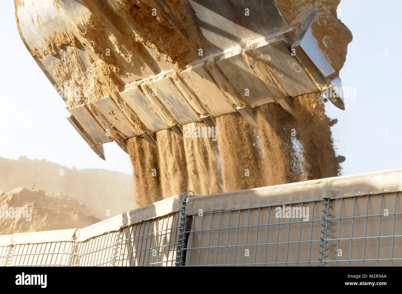 Dirt spills into the top of a Hesco barrier, Oct. 19. The 368th ...