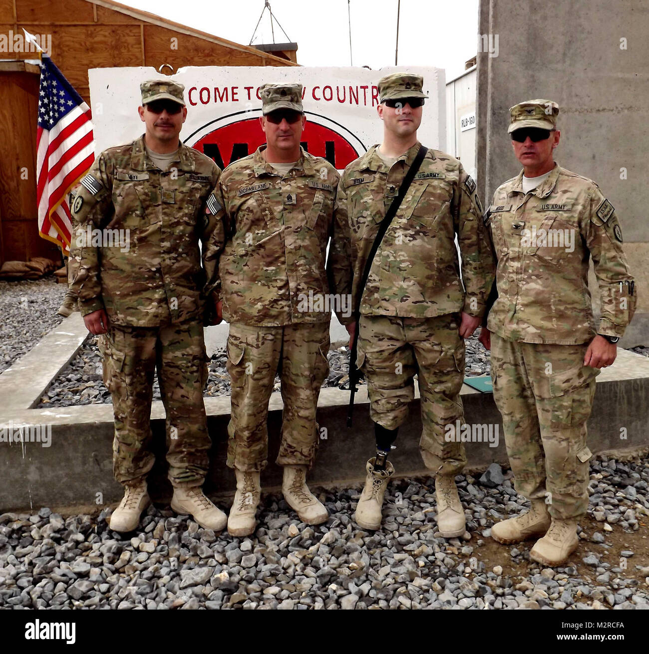 Staff Sgt. Brian Beem, a cavalry scout and amputee, poses with members ...