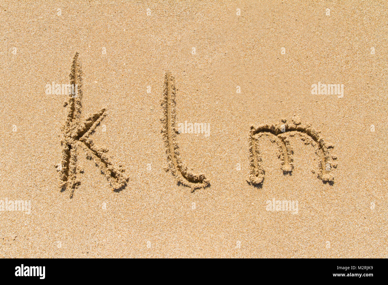 Set of klm letters of alphabet written on sand with lower case Stock ...