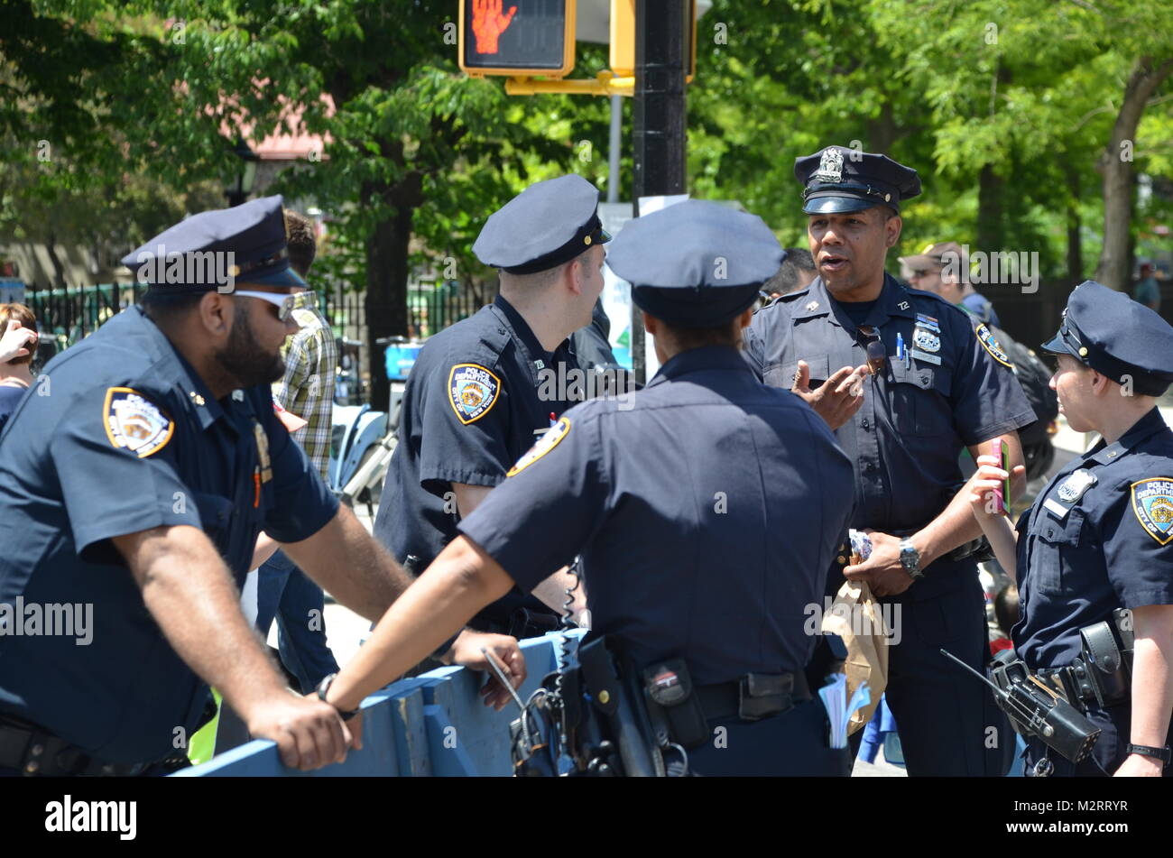 cops form the NYPD new york police department relax at a street fair in ...