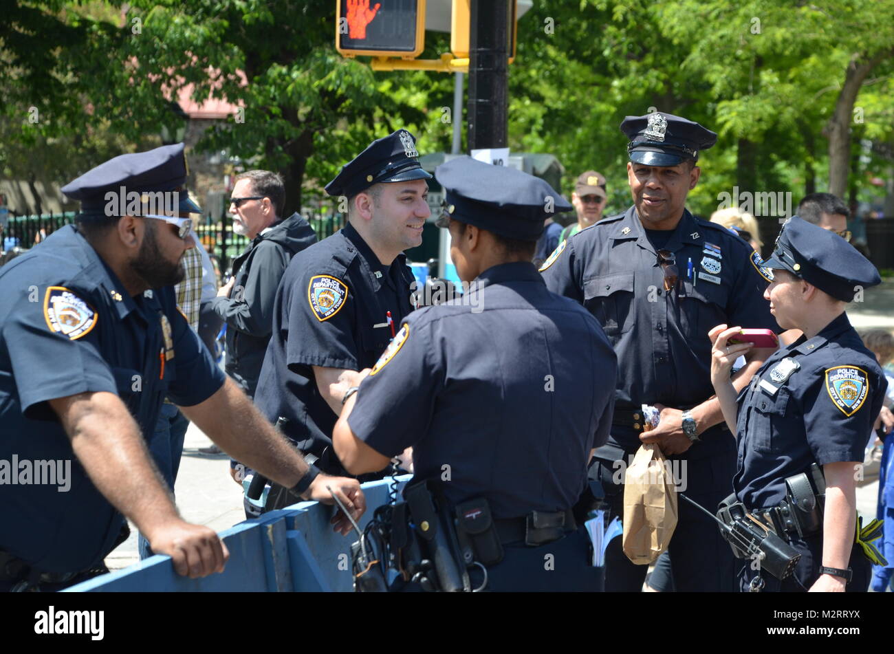 cops form the NYPD new york police department relax at a street fair in ...