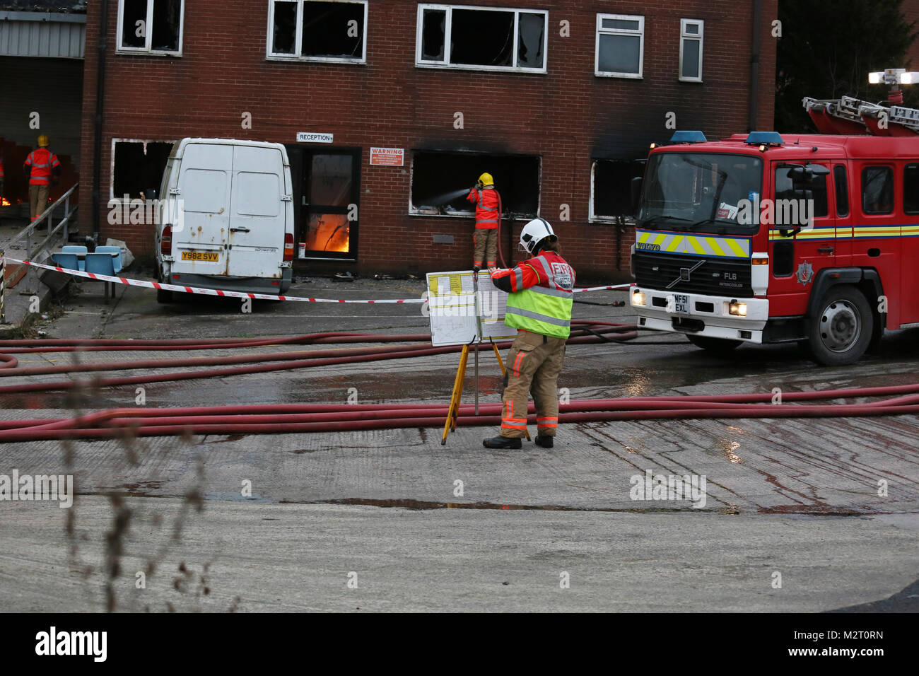 Rochdale, UK. 8th February, 2018. Fire fighters continue working to put ...
