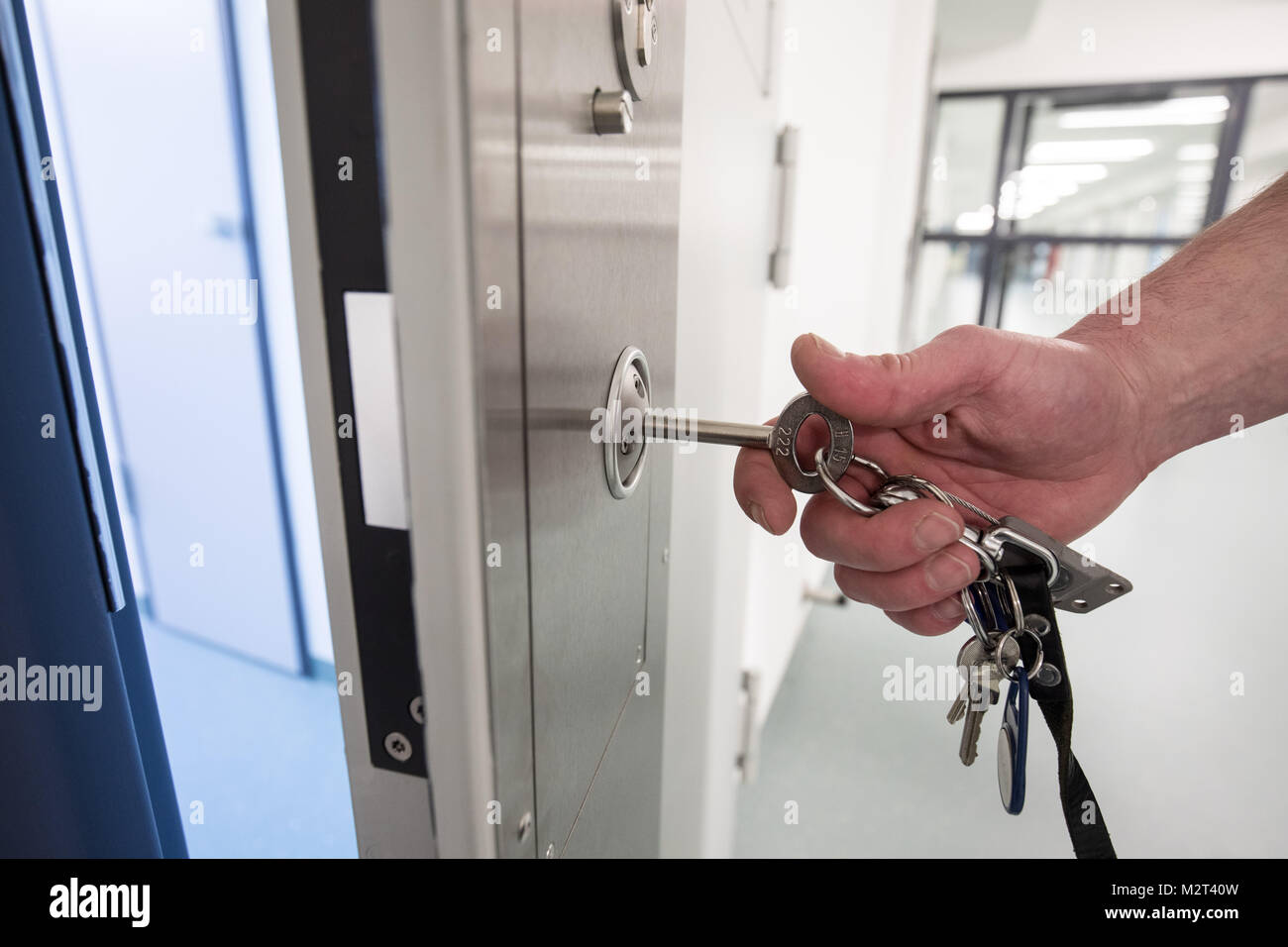 Hamburg, Germany. 08th Feb, 2018. A prison guard locking a cell's door ...