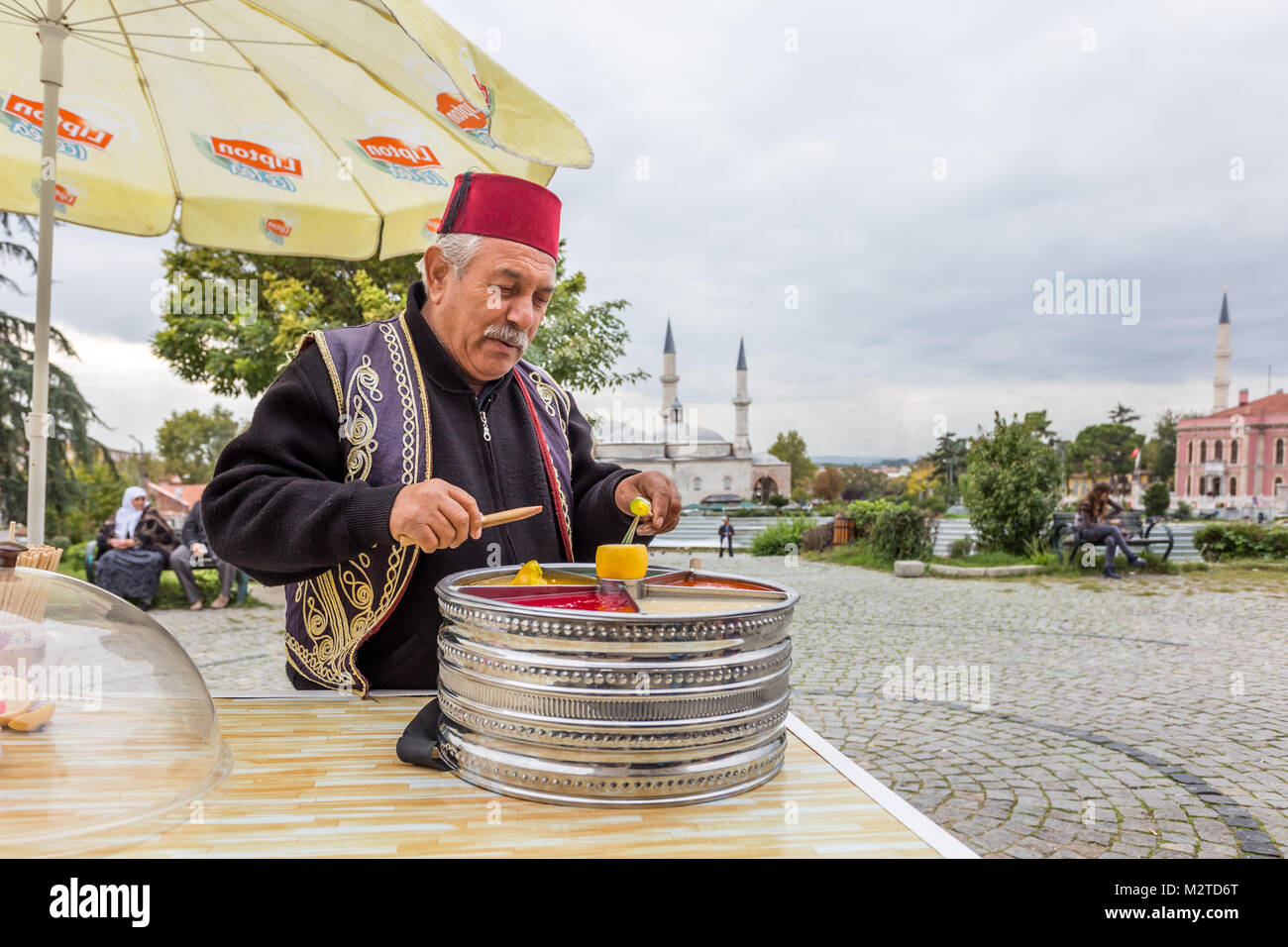 Unidentified man sells Ottoman Macun(Paste),soft, sweet and colorful ...