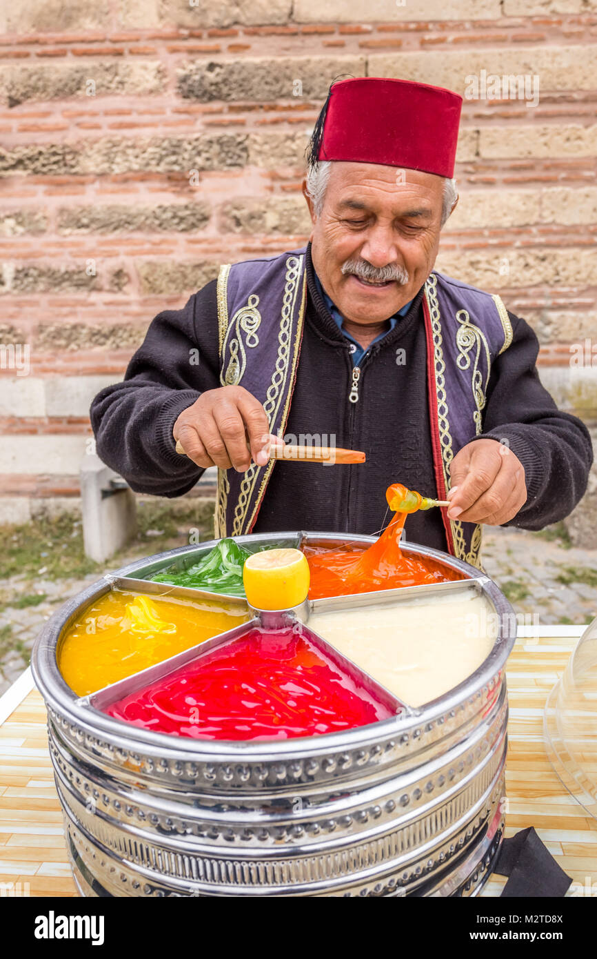 Unidentified man sells Ottoman Macun(Paste),soft, sweet and colorful ...