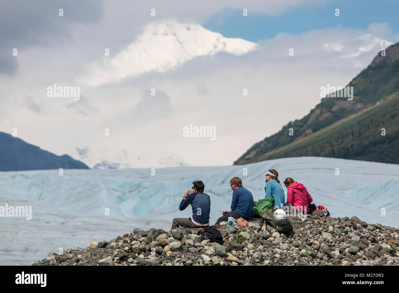 Hikers Having a Snack Overlooking the Root Glacier Stock Photo - Alamy