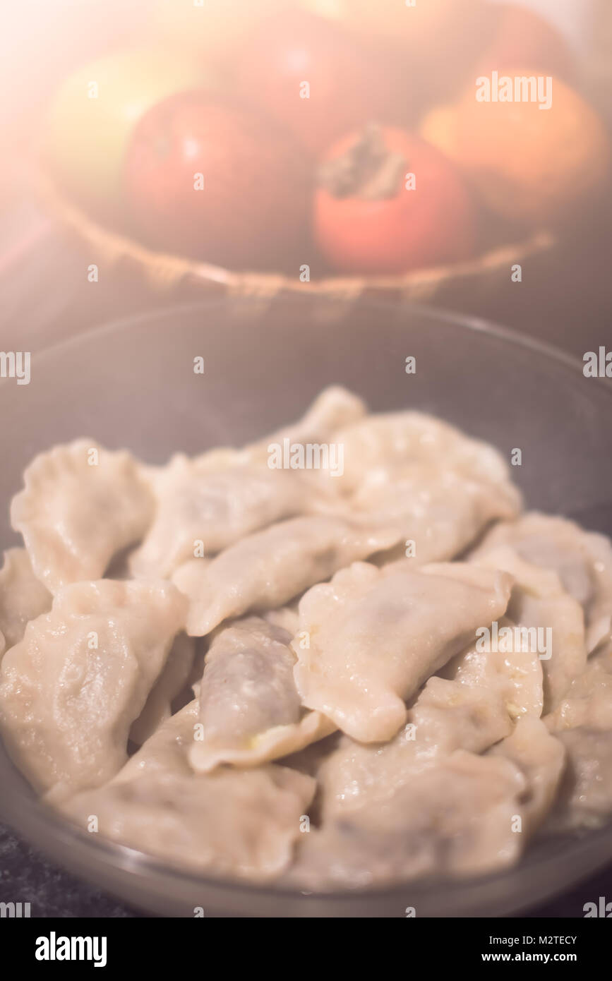 Traditonal Polish food called pierogi in a glass bowl ready to be ...