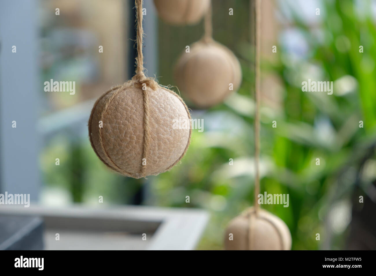 Coconut shell artificial hanging with blurred background Stock Photo ...