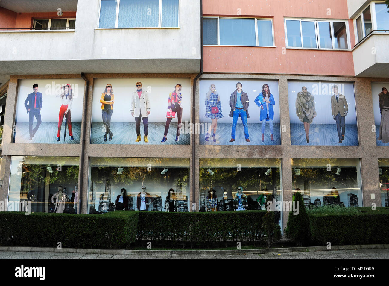 The shop window of a clothing store on the ground floor or a building ...